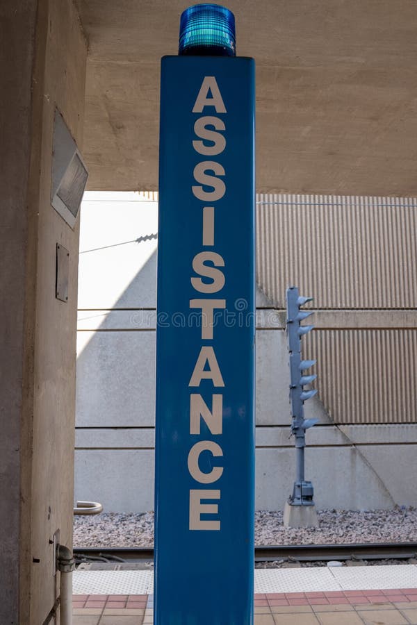 Blue Assistance Sign at Public Train Station Stock Photo - Image of ...