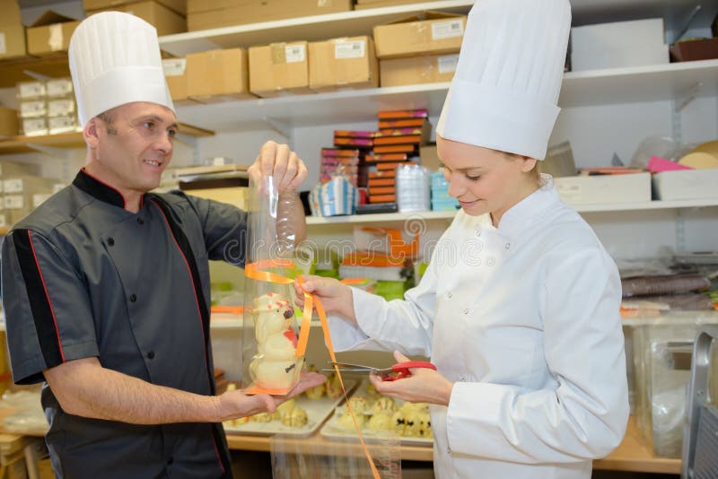 Assistant and Chef Discussing Menu in Kitchen Stock Image - Image of ...