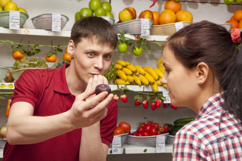 Assistant Helping Customer at Vegetable Counter of Shop Stock Image ...