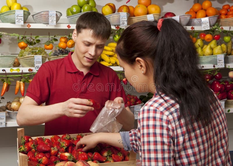 Assistant Helping Customer at Vegetable Counter of Shop Stock Photo ...