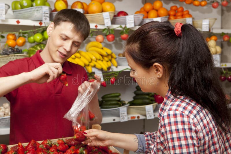 Assistant Helping Customer at Vegetable Counter of Shop Stock Photo ...