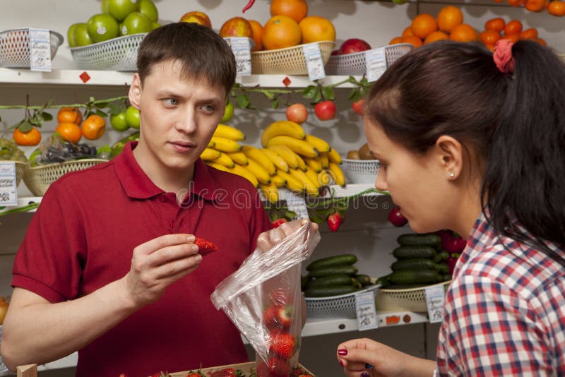 Assistant Helping Customer at Vegetable Counter of Shop Stock Photo ...