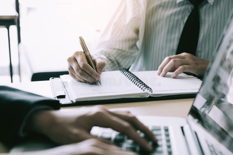 Assistant Manager is Taking Notes To the Supervisor Who is Using the ...