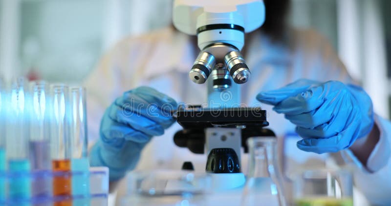 Assistant Puts Glass Slide with Sample on Microscope in Lab Stock Video ...