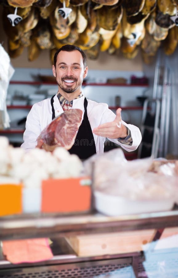 Assistant Showing Piece of Meat in Butcher Store Stock Image - Image of ...