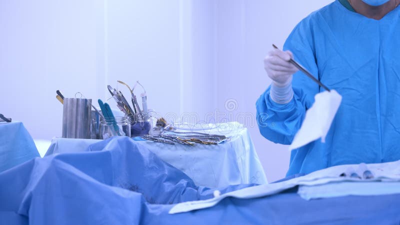 Assistant Surgeon Prepares Instruments in Rubber Gloves and Hands To ...