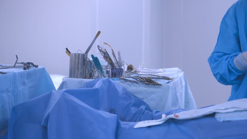 Assistant Surgeon Prepares Instruments in Rubber Gloves and Hands To ...