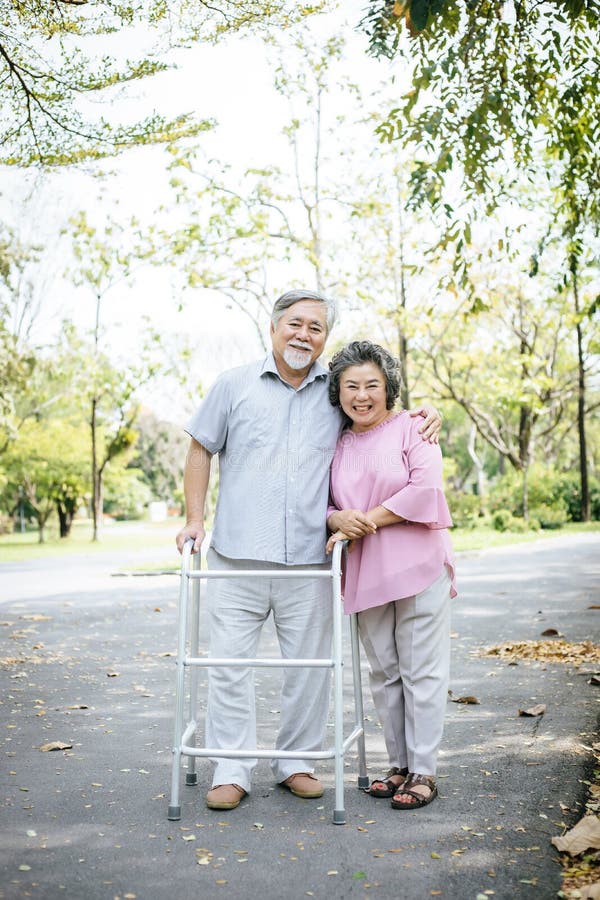 Assisting Her Senior Patient Who`s Using a Walker Stock Image - Image ...