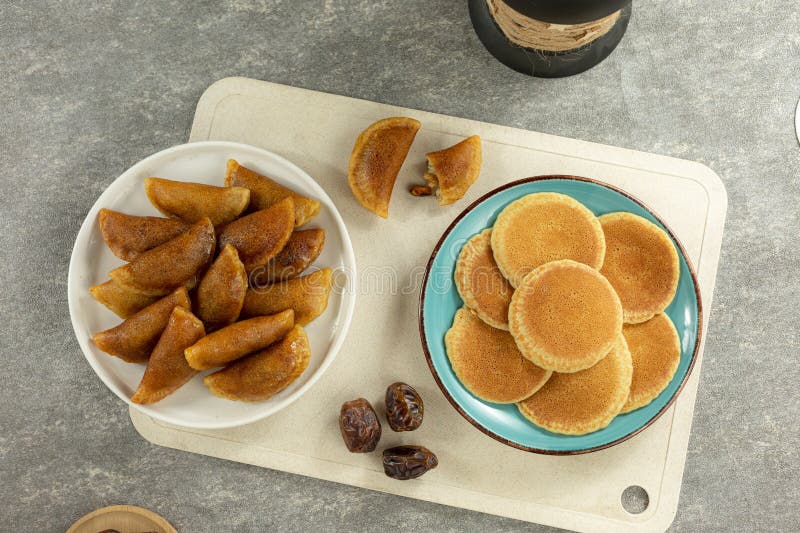 Flat Lay of Assorted Arabic Desserts with Qatayef As the Centerpiece ...