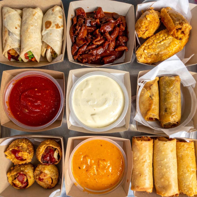 Assorted Asian Appetizers with Various Sauces in Cardboard Containers ...