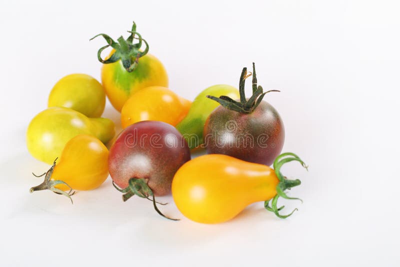 Assorted Baby Heirloom Tomatoes on White Stock Photo - Image of food ...