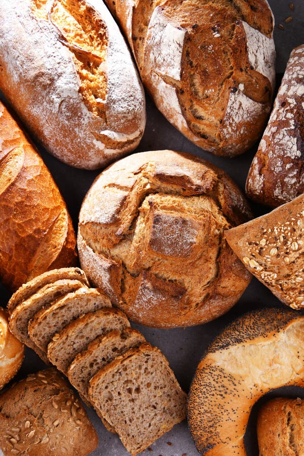 Assorted Bakery Products Including Loafs of Bread and Rolls Stock Photo ...