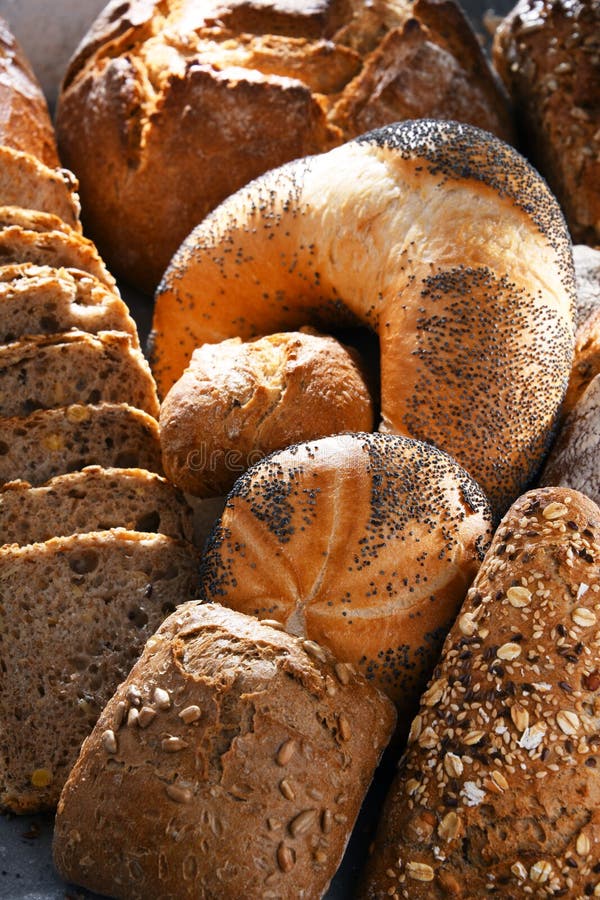 Assorted Bakery Products Including Loafs of Bread and Rolls Stock Photo ...