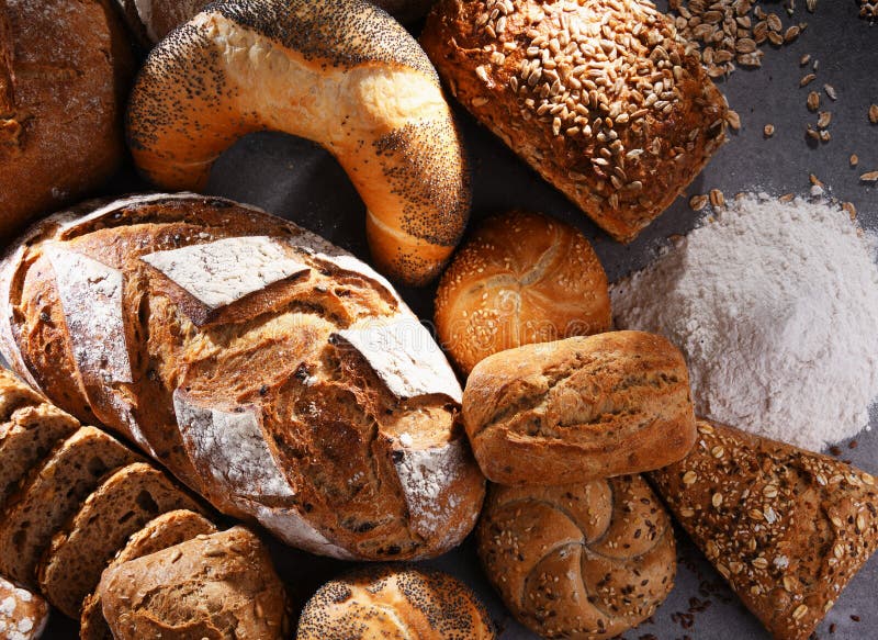 Assorted Bakery Products Including Loafs of Bread and Rolls Stock Photo ...