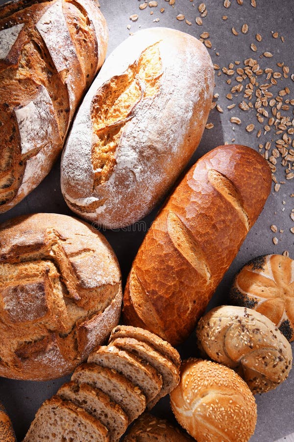 Assorted Bakery Products Including Loafs of Bread and Rolls Stock Photo ...