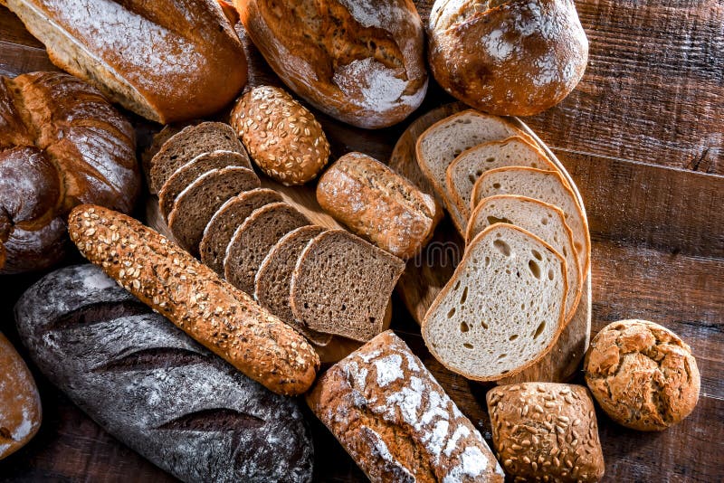 Assorted Bakery Products Including Loafs of Bread and Rolls Stock Photo ...