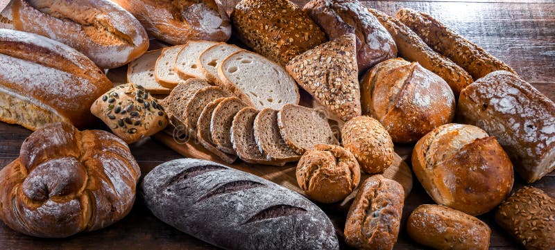 Assorted Bakery Products Including Loafs of Bread and Rolls Stock Photo ...