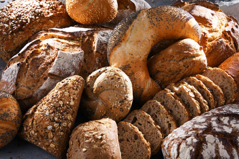 Assorted Bakery Products Including Loafs of Bread and Rolls Stock Photo ...