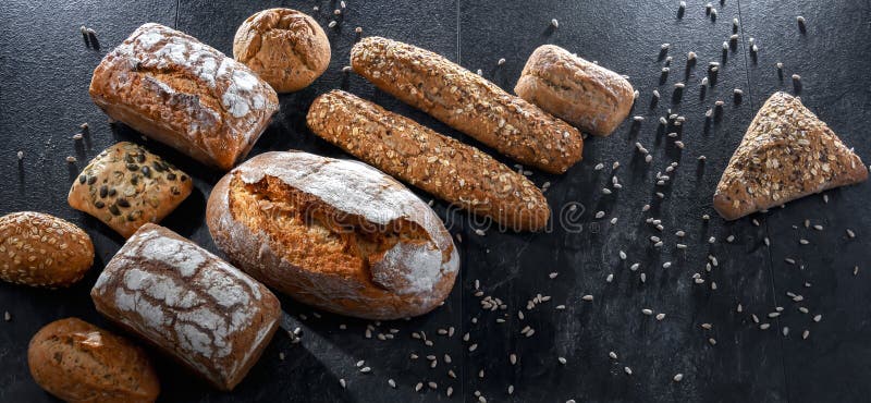 Assorted Bakery Products Including Loaves of Bread and Rolls Stock ...