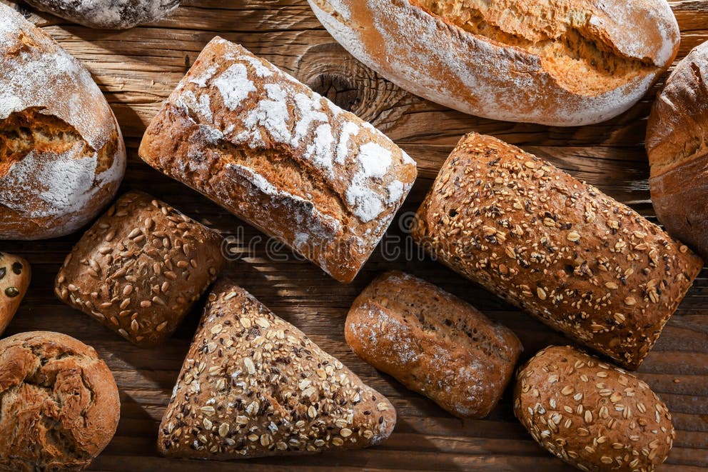 Assorted Bakery Products Including Loaves of Bread and Rolls Stock ...