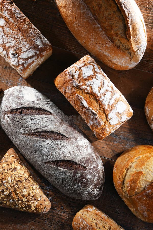 Assorted Bakery Products Including Loaves of Bread and Rolls Stock ...