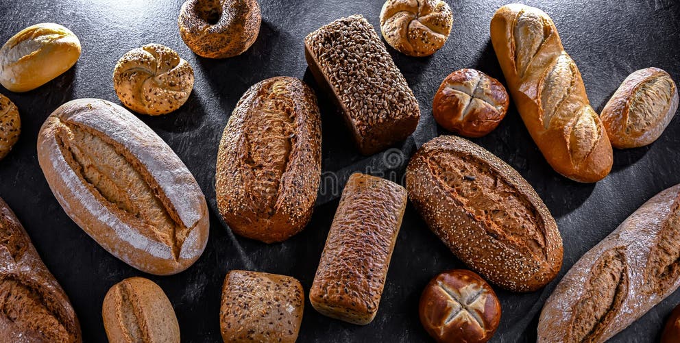 Assorted Bakery Products Including Loaves of Bread and Rolls Stock ...