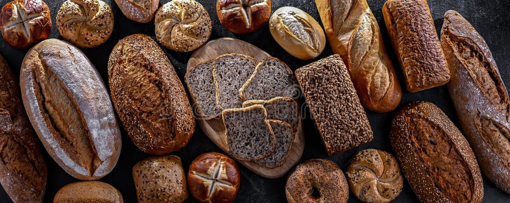 Assorted Bakery Products Including Loaves of Bread and Rolls Stock ...
