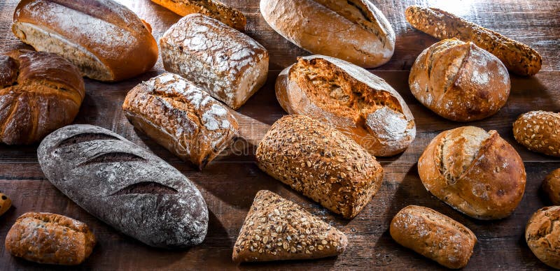Assorted Bakery Products Including Loaves of Bread and Rolls Stock ...