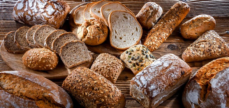 Assorted Bakery Products Including Loaves of Bread and Rolls Stock ...