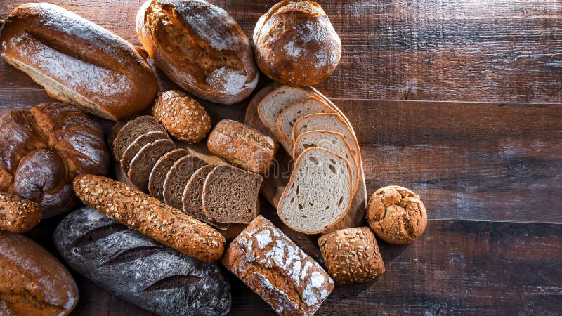 Assorted Bakery Products Including Loaves of Bread and Rolls Stock ...