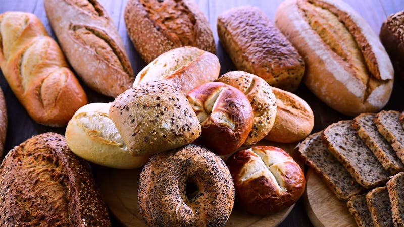 Assorted Bakery Products Including Loaves of Bread and Rolls Stock ...