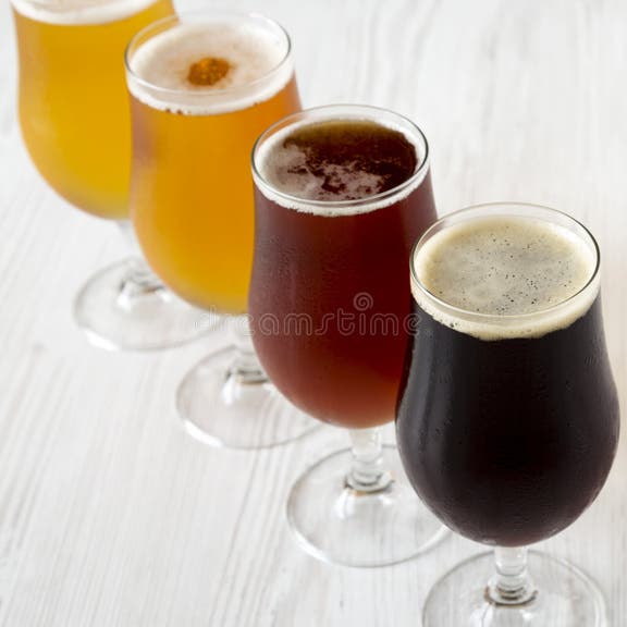 Assorted Beers, Side View. Close-up Stock Photo - Image of pint, froth ...