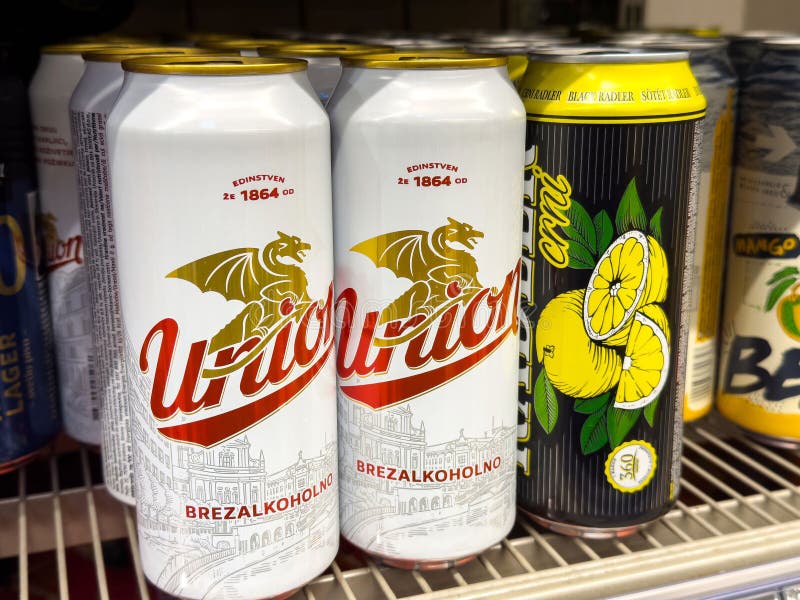 Assorted Beverages on Store Shelf Includes Beer and Citrus Drink Cans ...