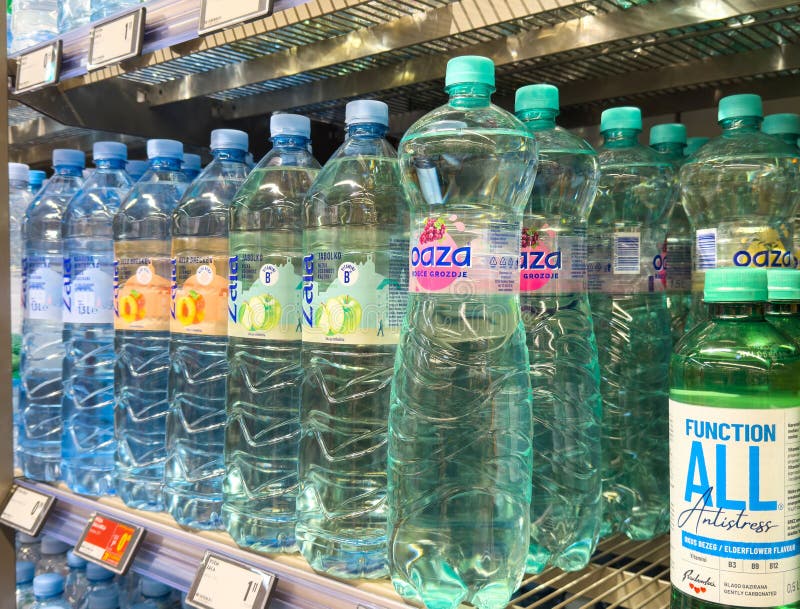 Assorted Bottled Water on Store Shelf with Various Labels and Colorful ...