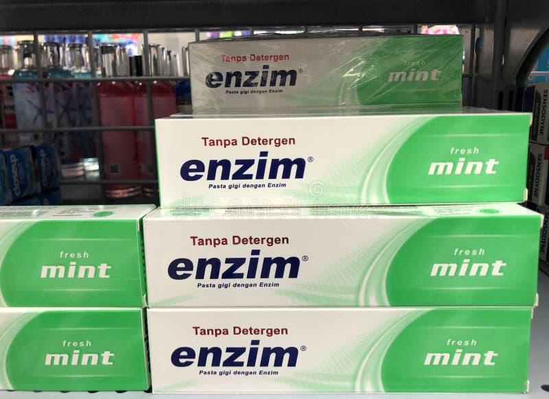 Assorted Brand of Toothpaste on Shelf Rack Display in the Tesco Store ...