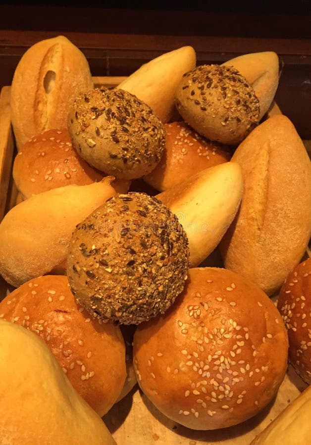 Assorted Breads Stacked on Table in Bakery, Staple Food Stock Image ...