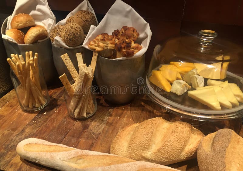 Assorted Breads Stacked on Table in Bakery, Staple Food Stock Image ...