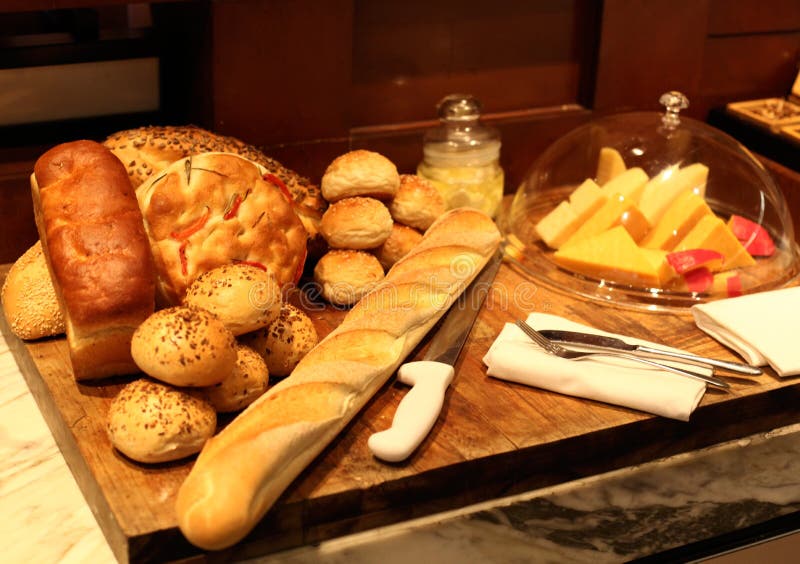 Assorted Breads Stacked on Table in Bakery, Staple Food Stock Image ...