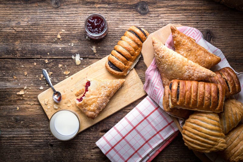 Assorted Breakfast Pastries with Jam and Milk Stock Photo - Image of ...