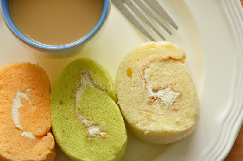 Assorted Cake Roll and Coffee Cup with Fork on Dish Stock Photo - Image ...