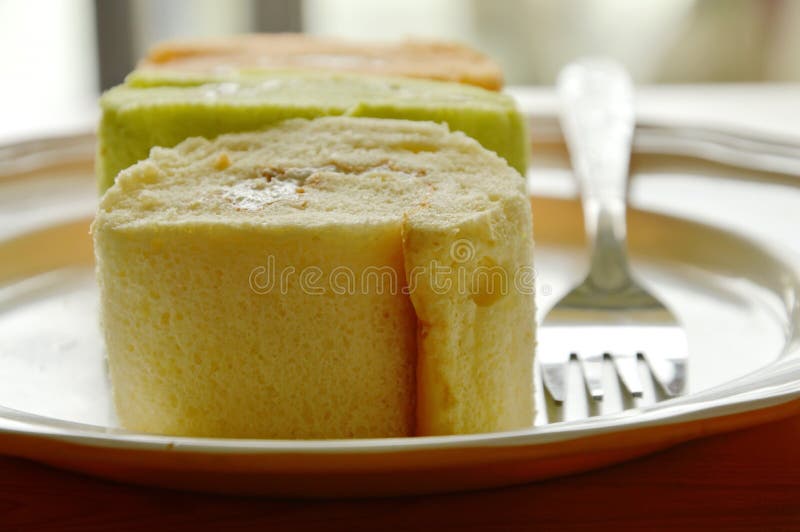 Assorted Cake Roll with Fork on Plate Stock Photo - Image of plate ...