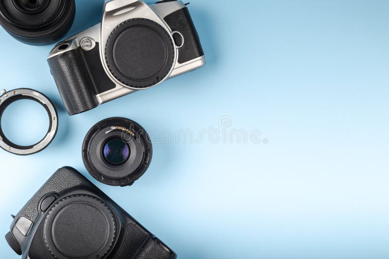 Assorted Cameras on a Blue Backdrop Seen from Above. Stock Image ...