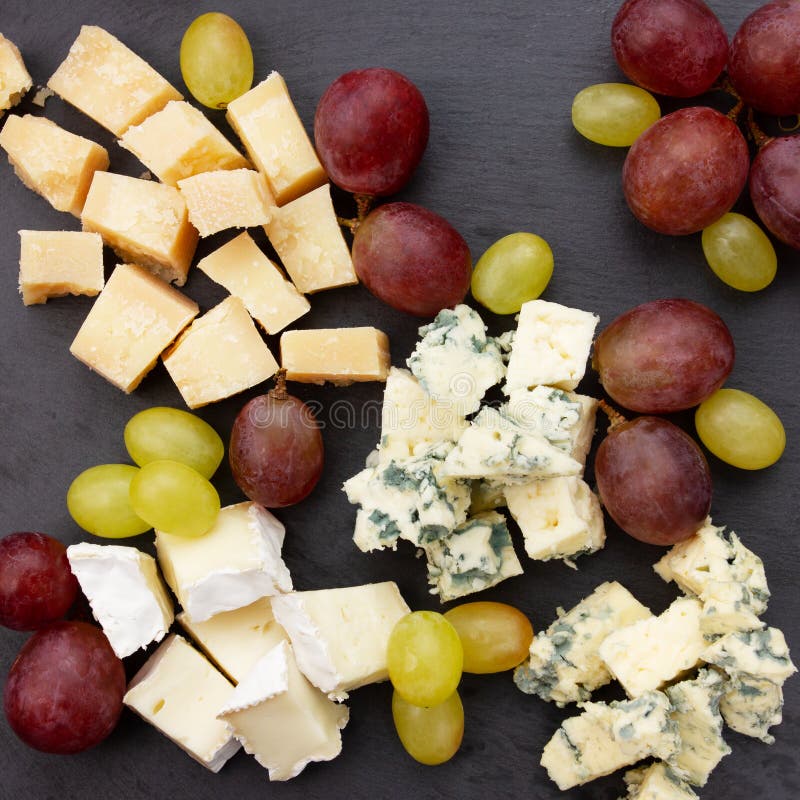 Assorted Cheeses on a Black Plate. Stock Photo - Image of soft, variety ...