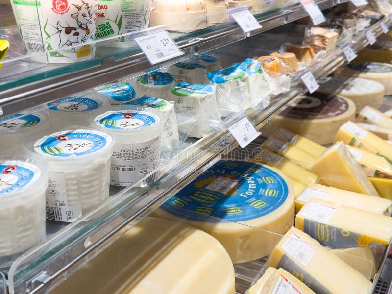 Assorted Cheeses on Display in Refrigerated Grocery Store Aisle Stock ...