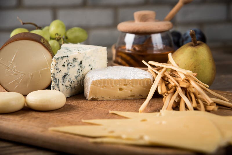 Assorted Cheeses in Various Shapes and Sizes Stock Photo - Image of ...