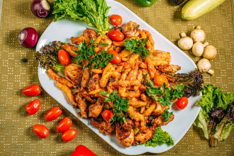 Assorted Chicken, a Dish for the Company, on a Decorated Table Stock ...