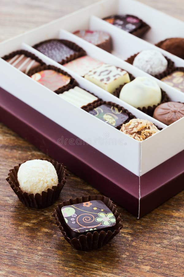Assorted Chocolate Candies on a Wooden Table Stock Photo - Image of ...
