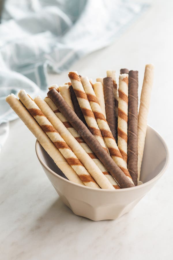 Assorted Chocolate and Vanilla Cream Filled Wafer Rolls in Bowl on ...