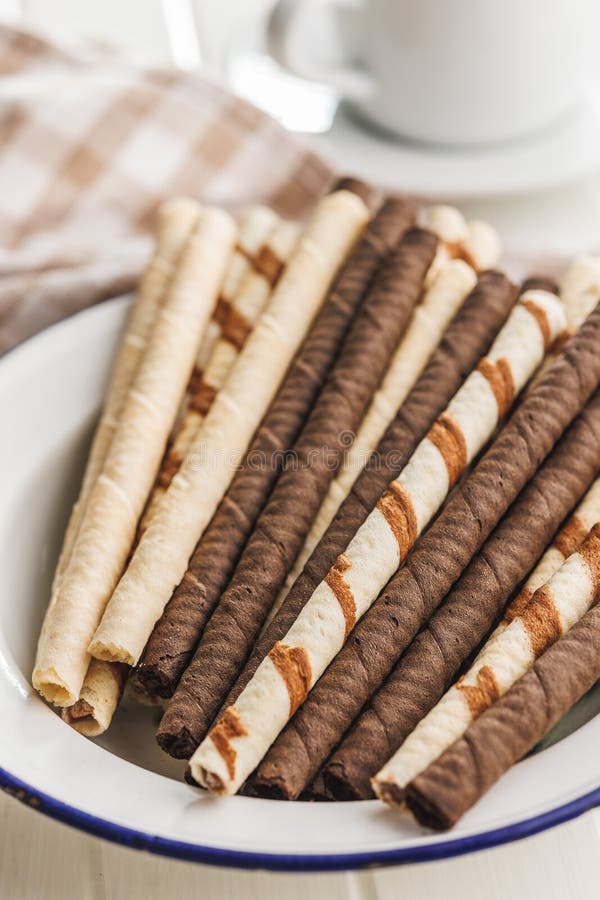 Assorted Chocolate and Vanilla Cream Filled Wafer Rolls in Bowl on ...