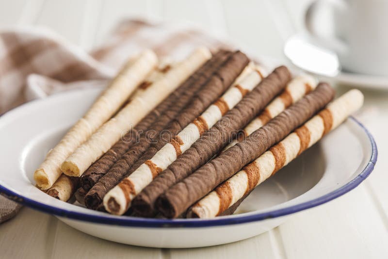 Assorted Chocolate and Vanilla Cream Filled Wafer Rolls on Plate on ...